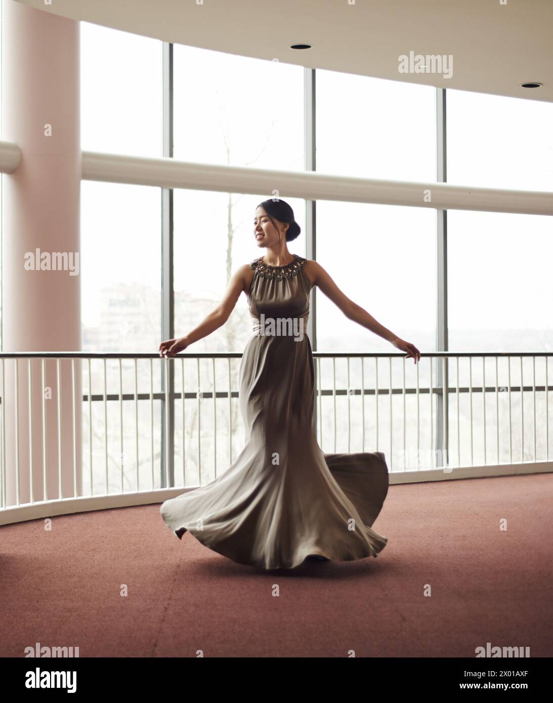 Woman, elegant dress and dancing in hallway, fashion and classy garment ...