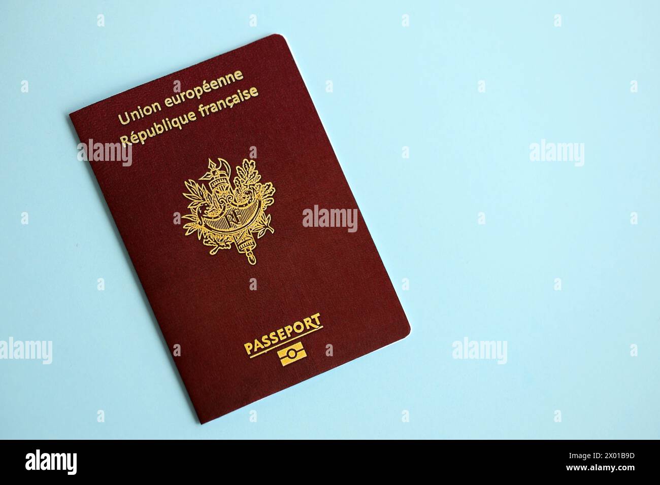 French passport on blue background close up. Tourism and citizenship ...
