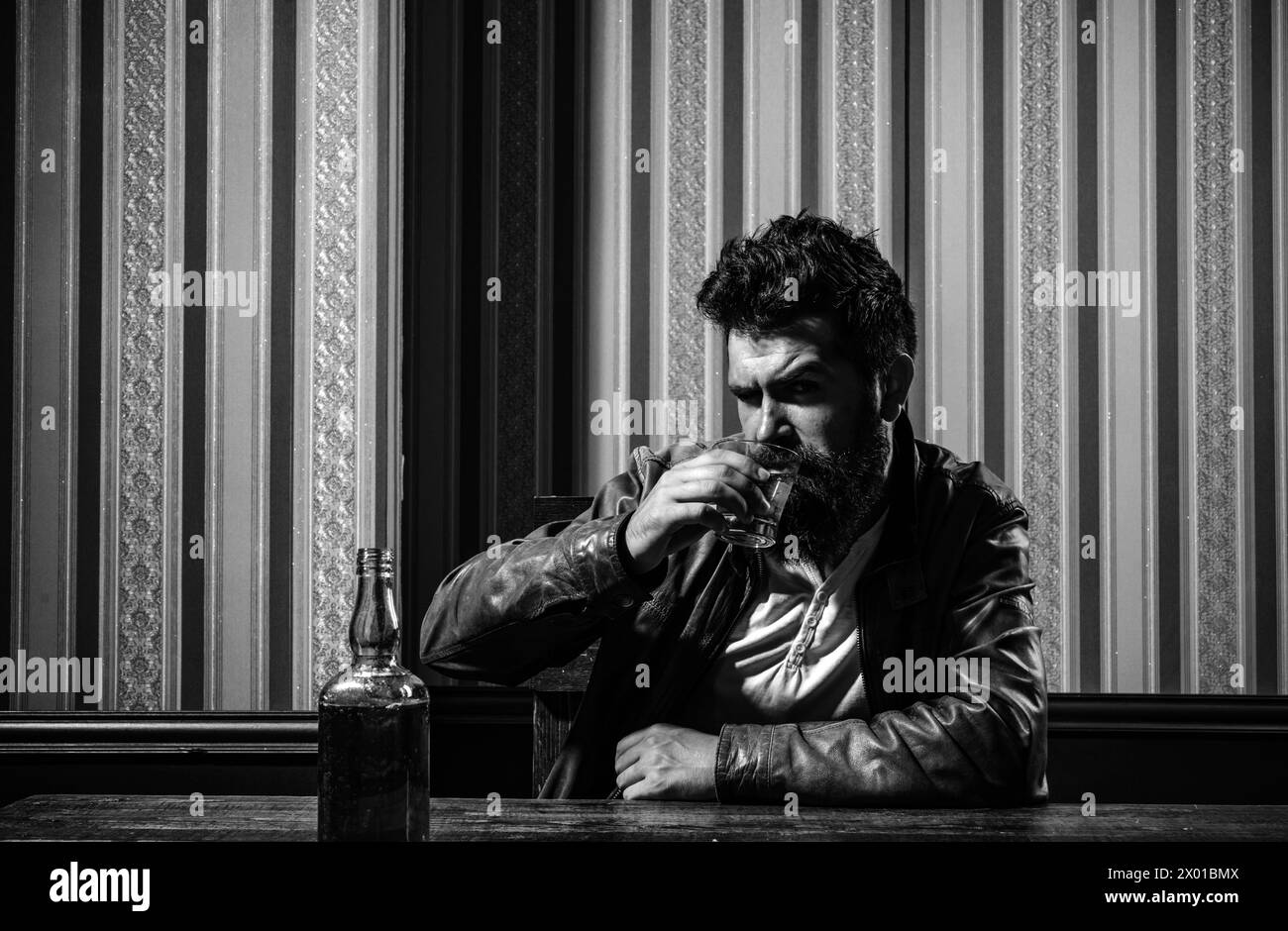 Upset man drinker alcoholic with glass drinking whiskey alone, sad ...