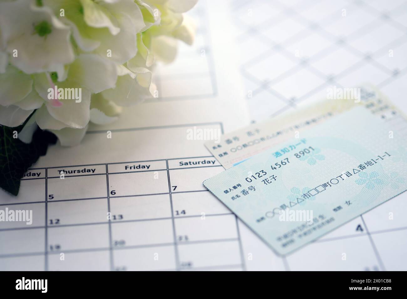 Japanese my number card specimen and notification card on calendar ...