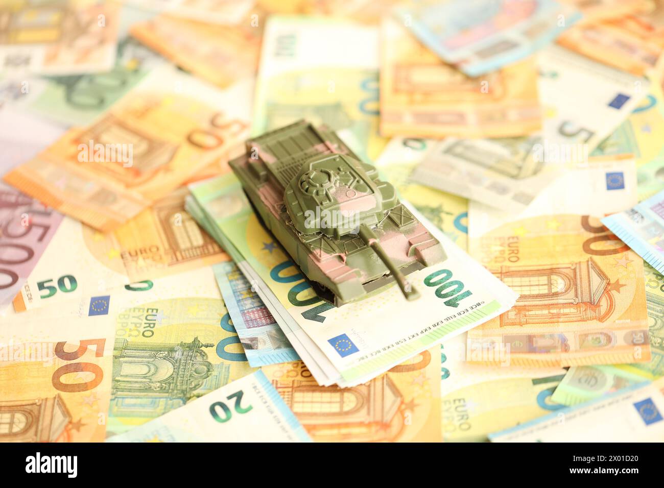 Many euro banknotes and tank. Lot of bills of European union currency ...