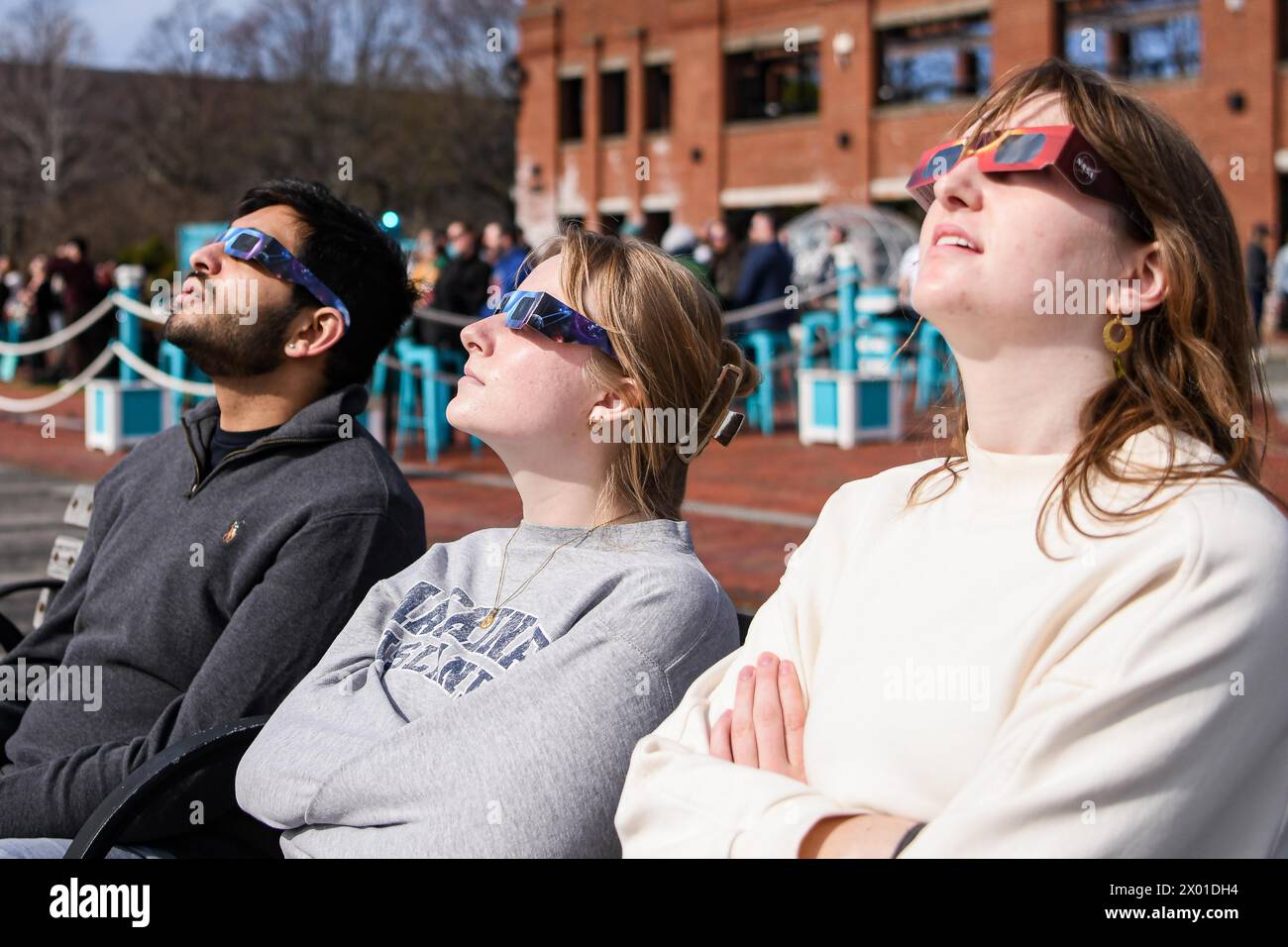 Boston, USA. 8th Apr, 2024. People watch a solar eclipse in Boston, the ...