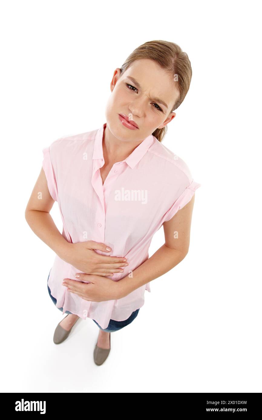 Portrait, woman and stomach ache in studio with pain, health issue and ...