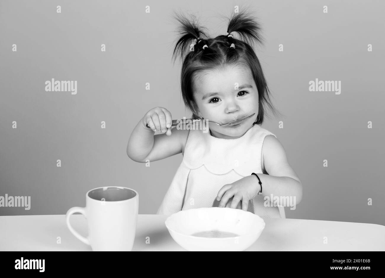 Babies eating, healthy food for a baby. Little baby eating fruit puree ...