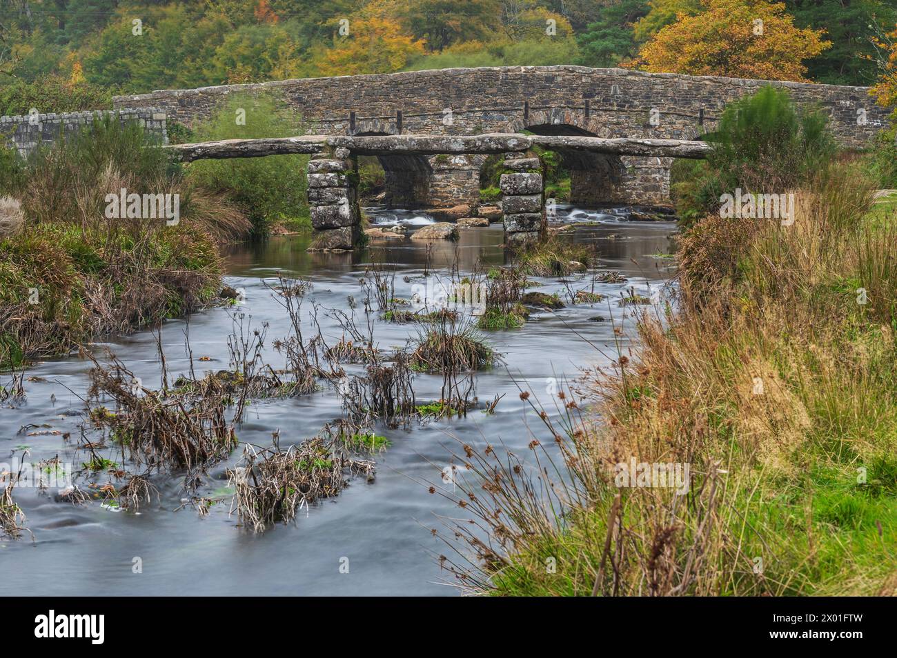 The 13th century stone clapper bridge over the East Dart River in the ...