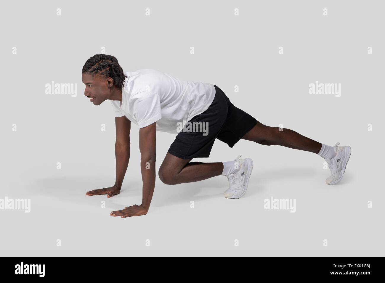 Man in starting position ready to sprint Stock Photo - Alamy