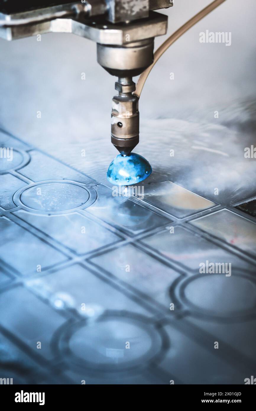 High pressure water jet cutting metal plate Stock Photo - Alamy