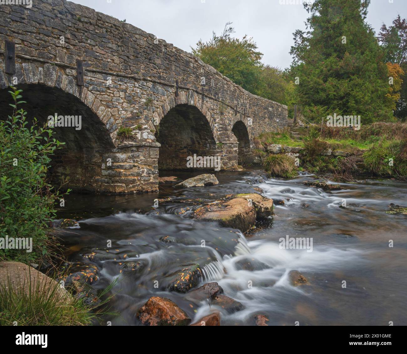 The 18th century road bridge over the East Dart River in the Dartmoor ...