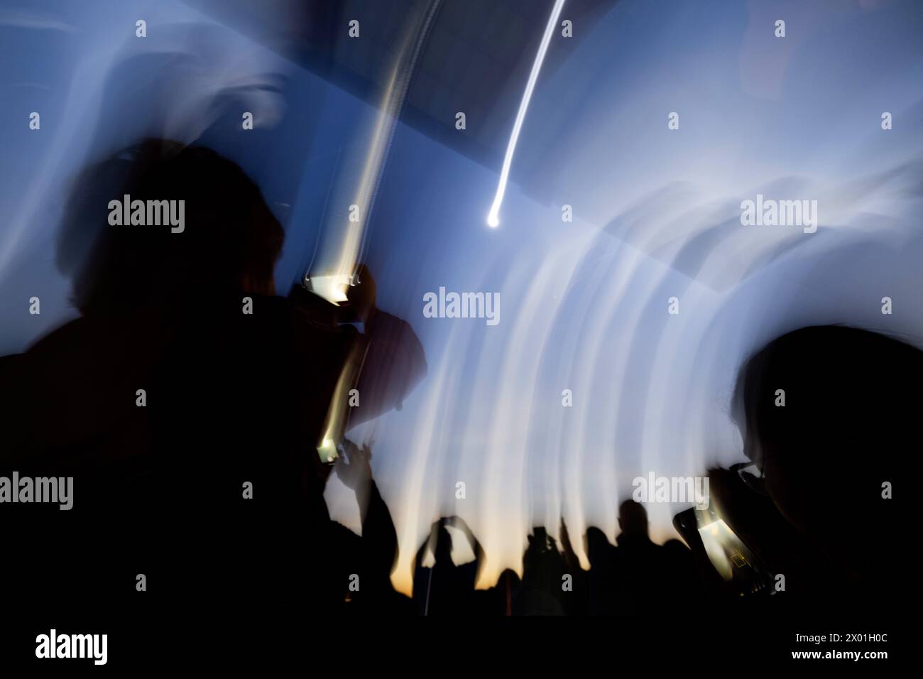 People are seen as they watch a total solar eclipse at the Indianapolis ...