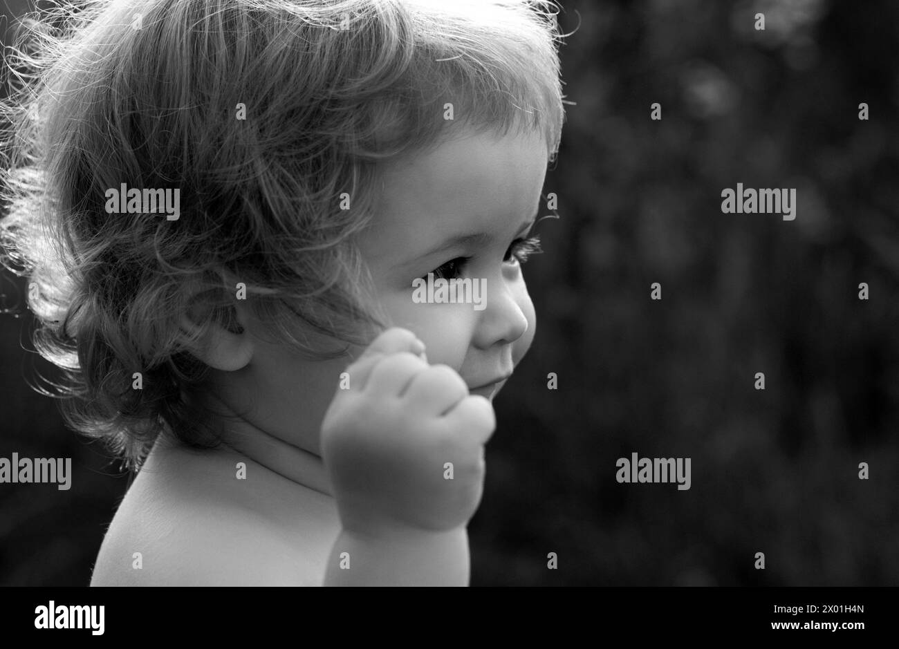 Little child play in park. Portrait of a happy baby in grass field ... Little child play in park. Portrait of a happy baby in grass field ...