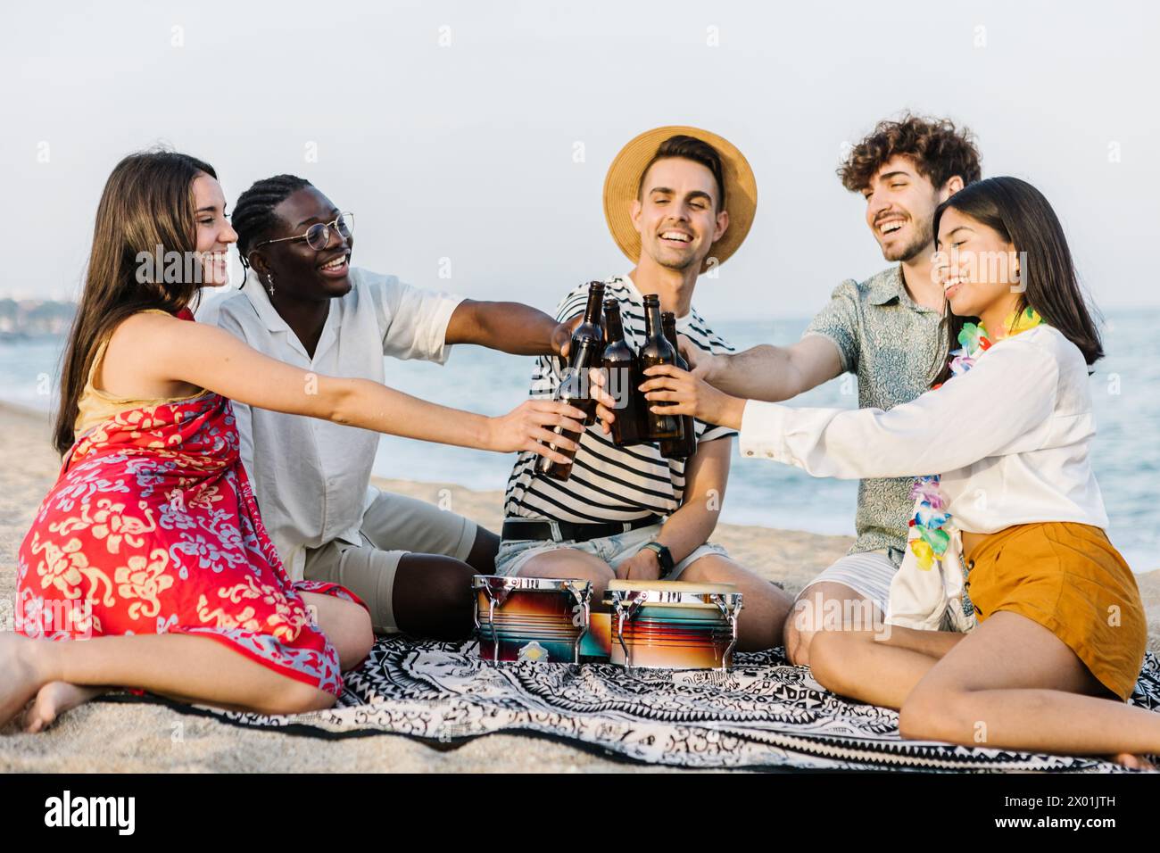 Young group of happy friends enjoying summer vacation at the beach ...
