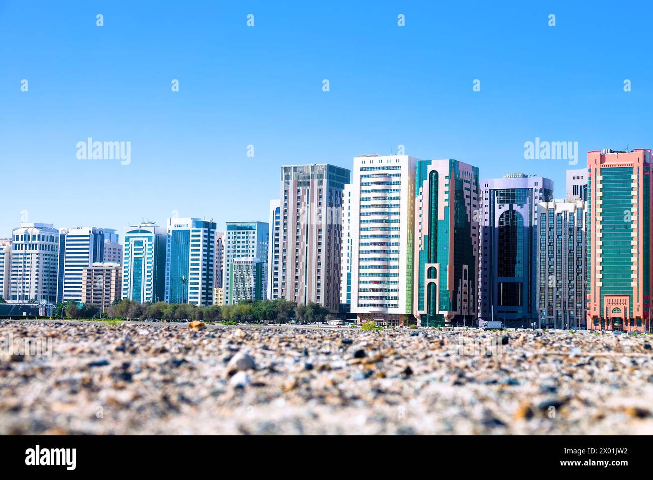 A modern new city rises straight out of the desert sands, satellite ...