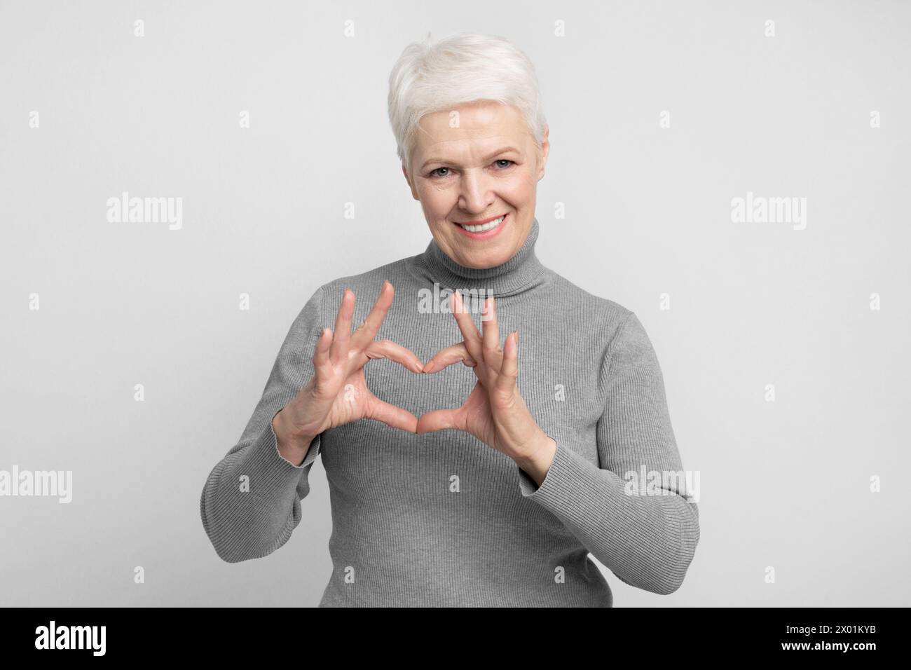 Caring hands making a heart hi-res stock photography and images - Alamy