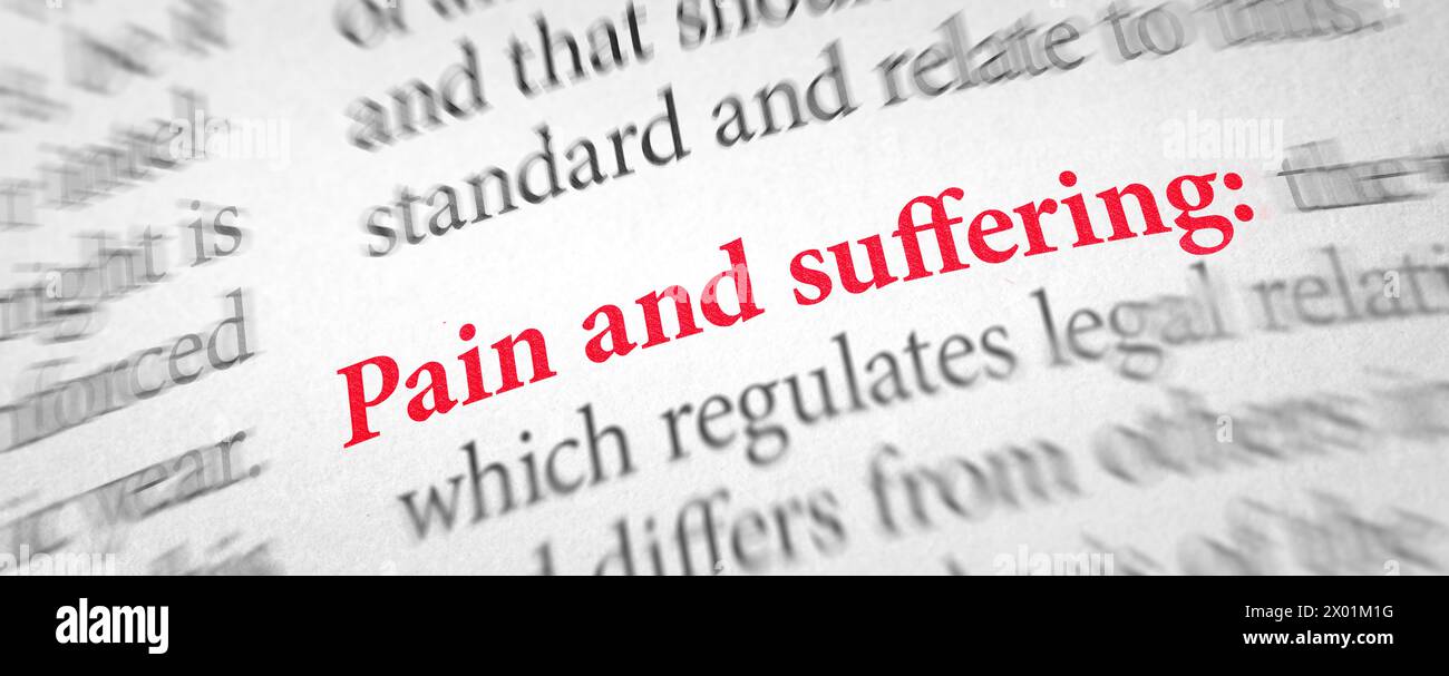 Definition of the term Pain and suffering in a dictionary Stock Photo ...