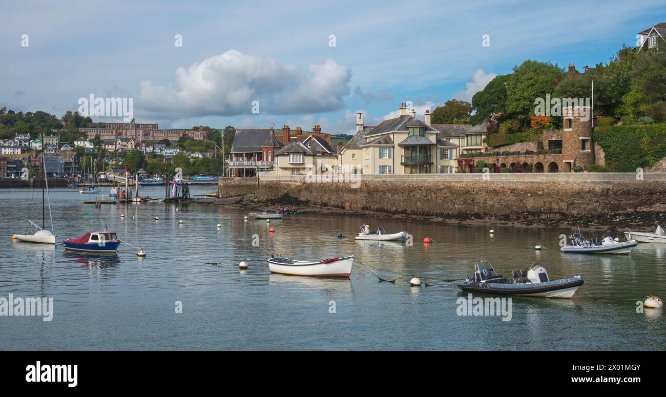 Pleasure craft moored in front of some large houses of Kingswear, Devon ...