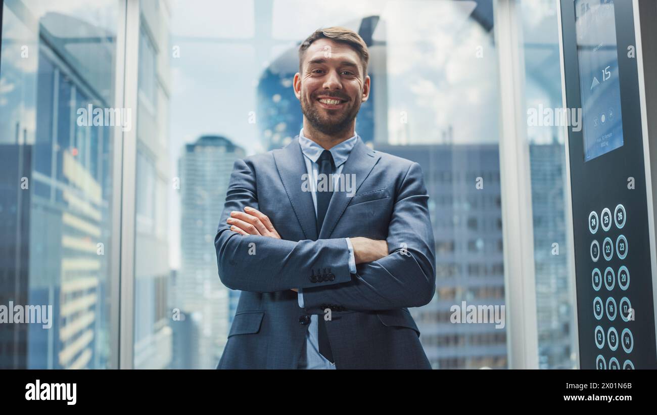 Portrait of a Successful Businessman in a Suit Riding Glass Elevator to ...