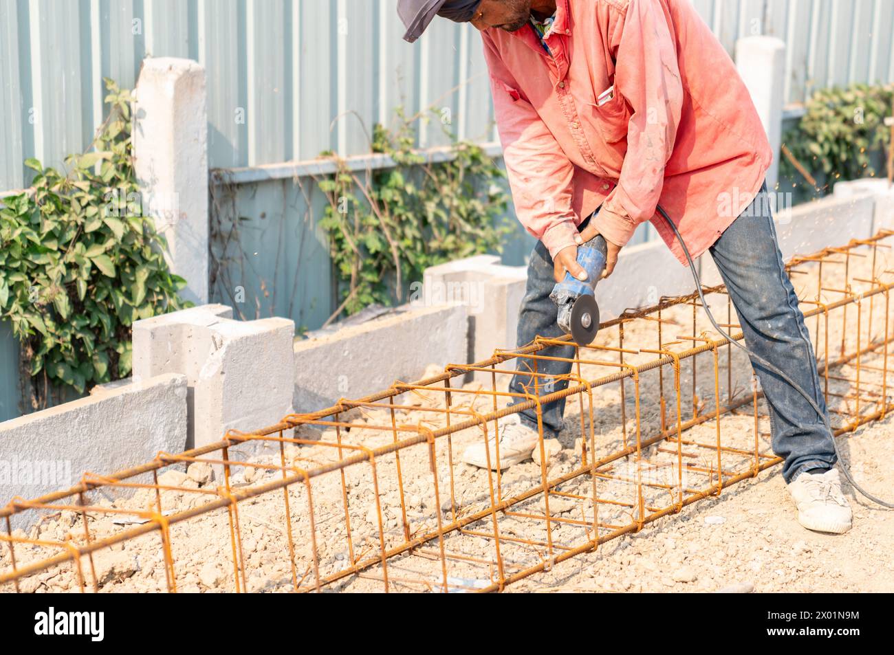 Construction worker cutting steel reinforcement bars prepare pour ...