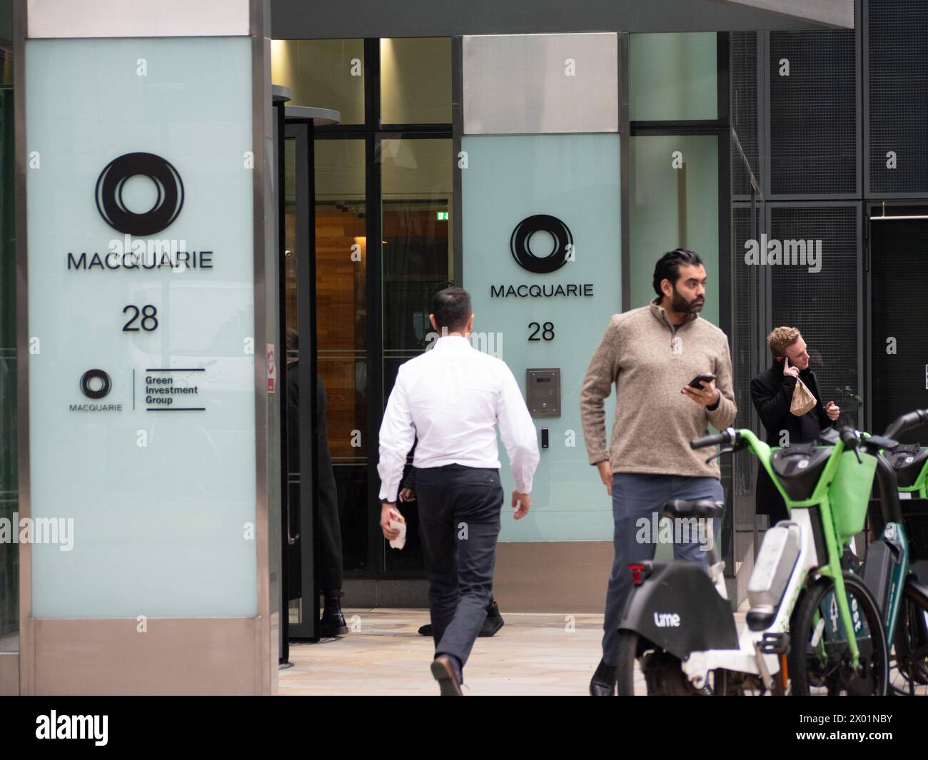 Pedestrians walking past Macquarie Bank Ropemaker Street, London Stock ...
