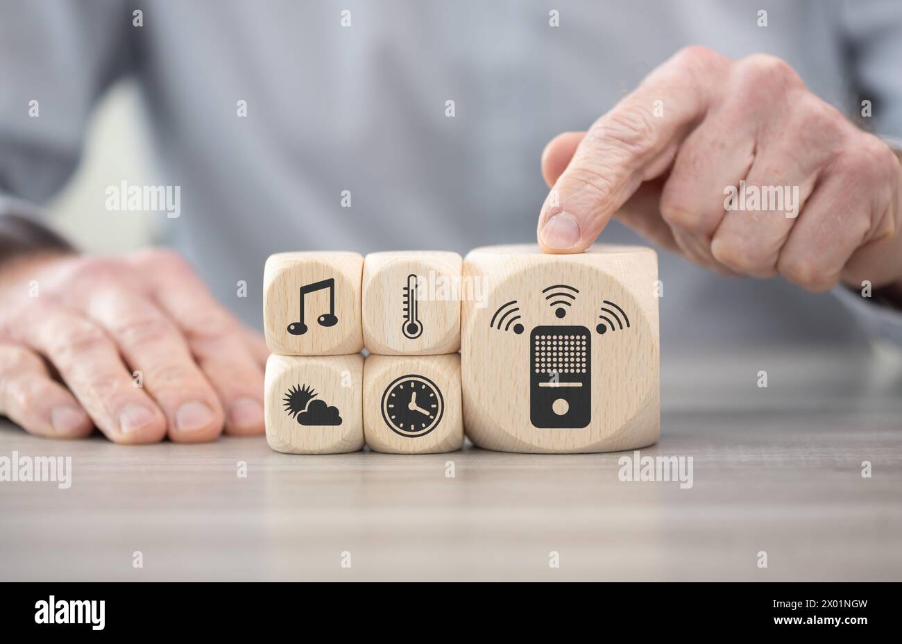 Wooden blocks with symbol of smart speaker concept Stock Photo - Alamy