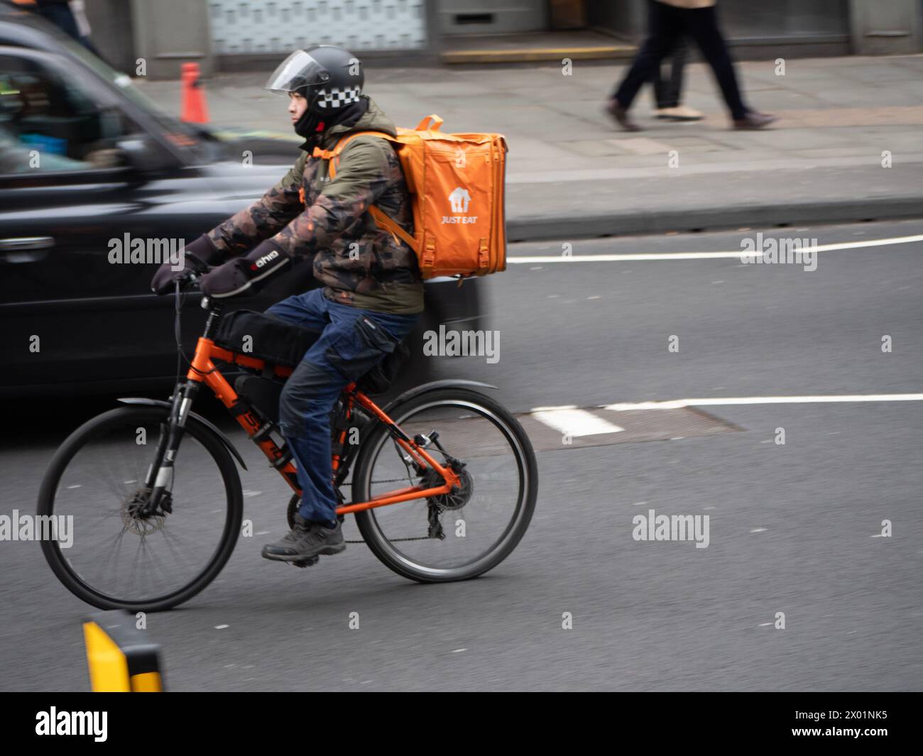 Just Eat Food delivery cyclist, in Central London Stock Photo - Alamy
