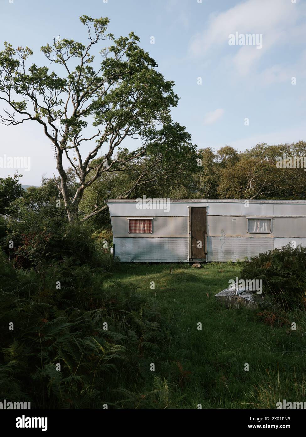 A run down static caravan in the wild remote landscape of Scotland UK ...