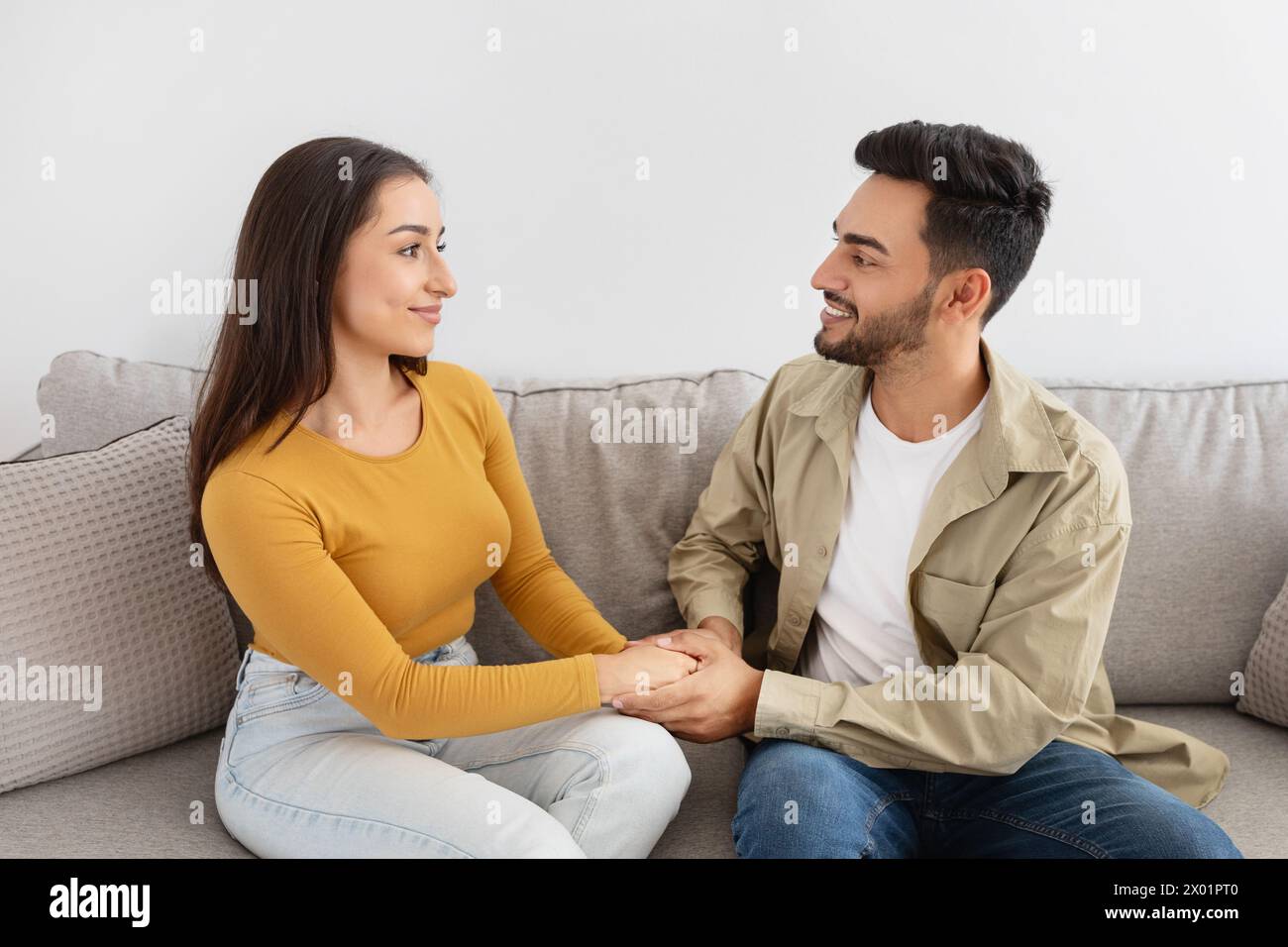 Couple talking holding hands hi-res stock photography and images - Alamy