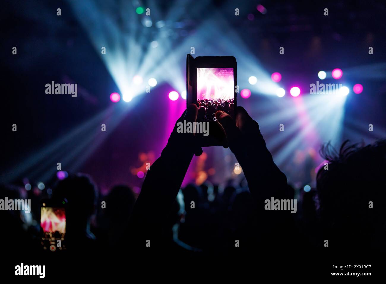 A mesmerizing moment unfolds at a live concert, recorded via mobile ...