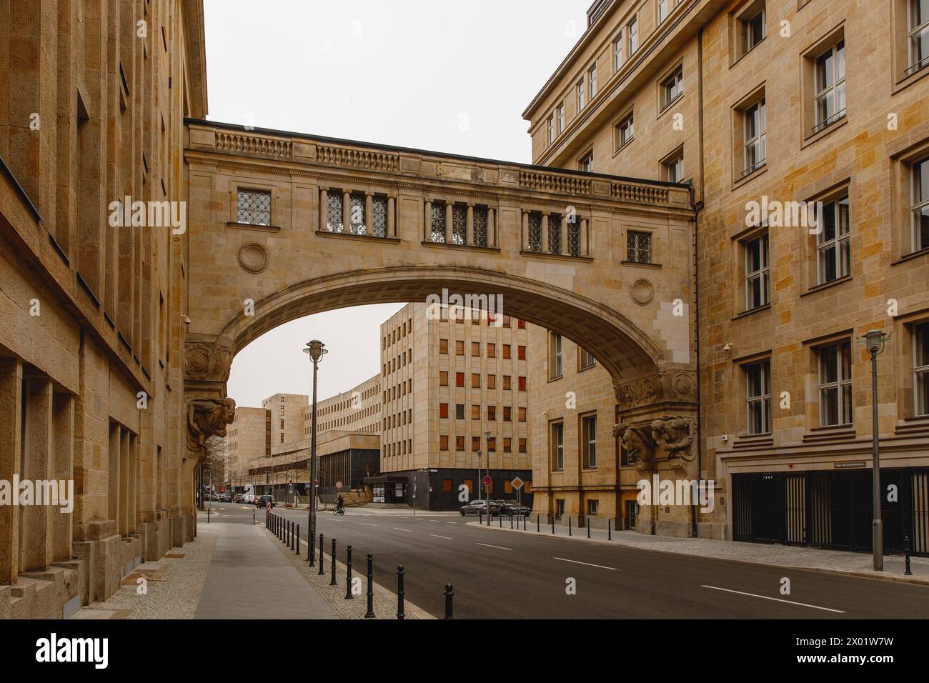 The elegant stone bridge connecting two buildings over a quiet city ...
