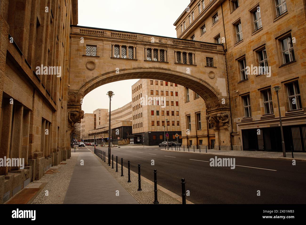 The elegant stone bridge connecting two buildings over a quiet city ...