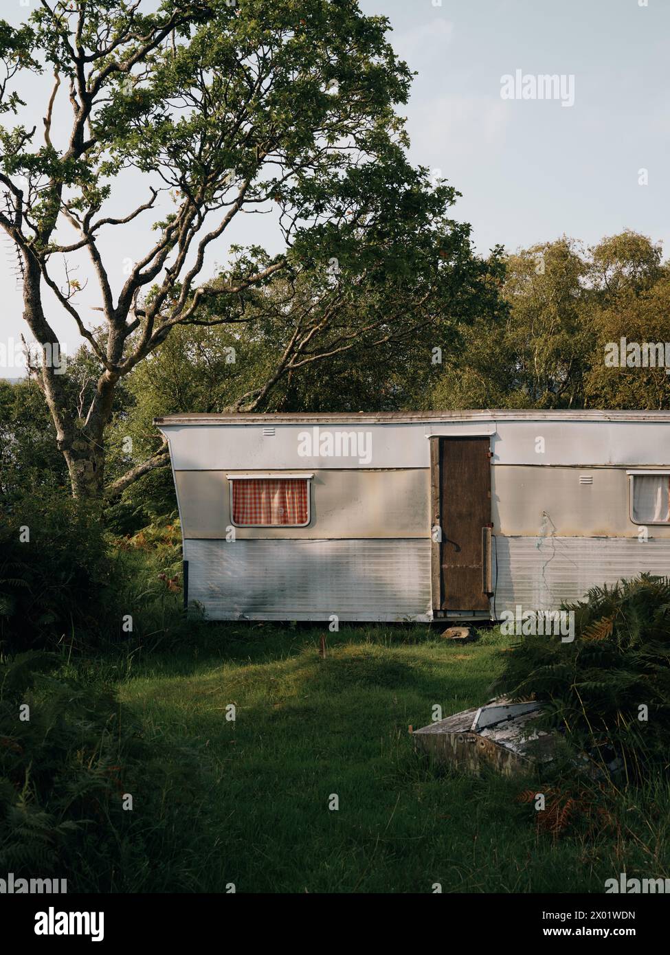 A run down static caravan in the wild remote landscape of Scotland UK ...