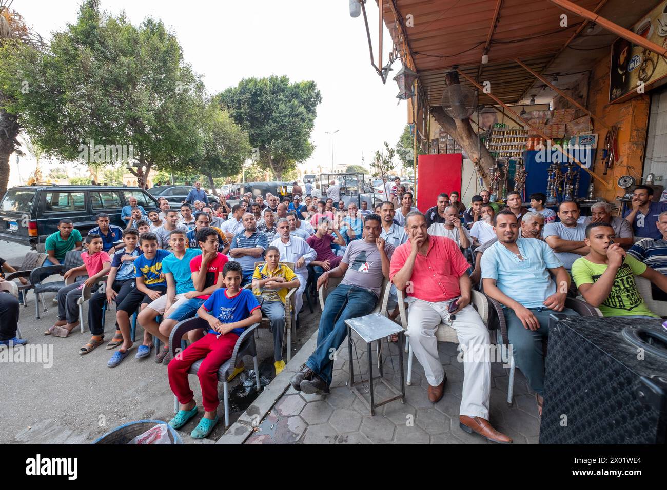CAIRO, EGYPT - AUGUST 31, 2017: A group of men and boys watch the ...