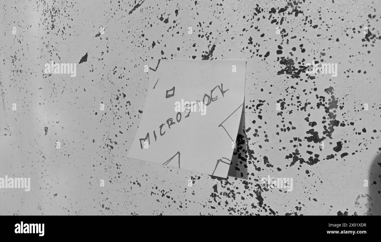 Photograph of business and money themed object with text in the note ...