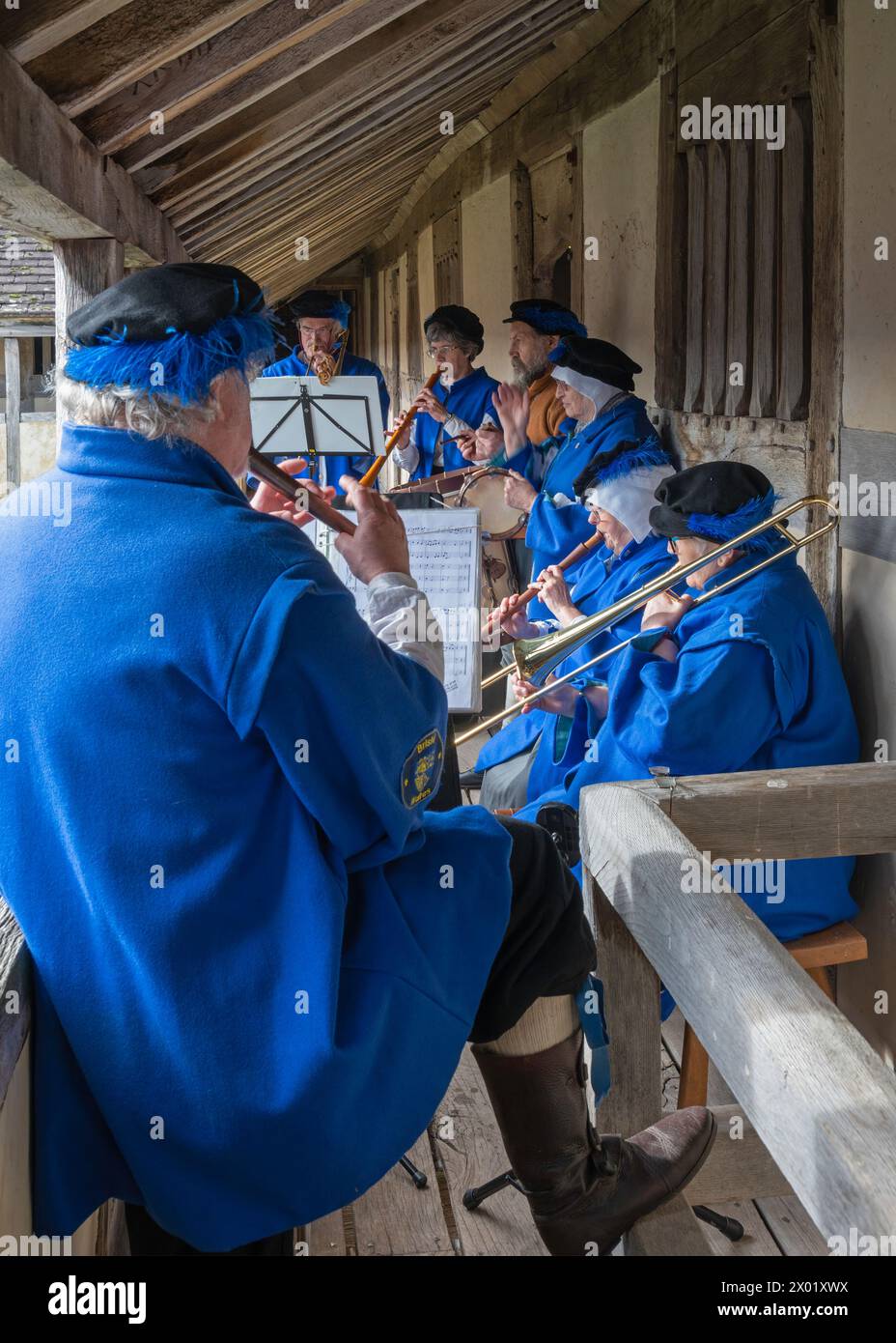 Minstrels playing their instruments on an open balcony at Tretower ...