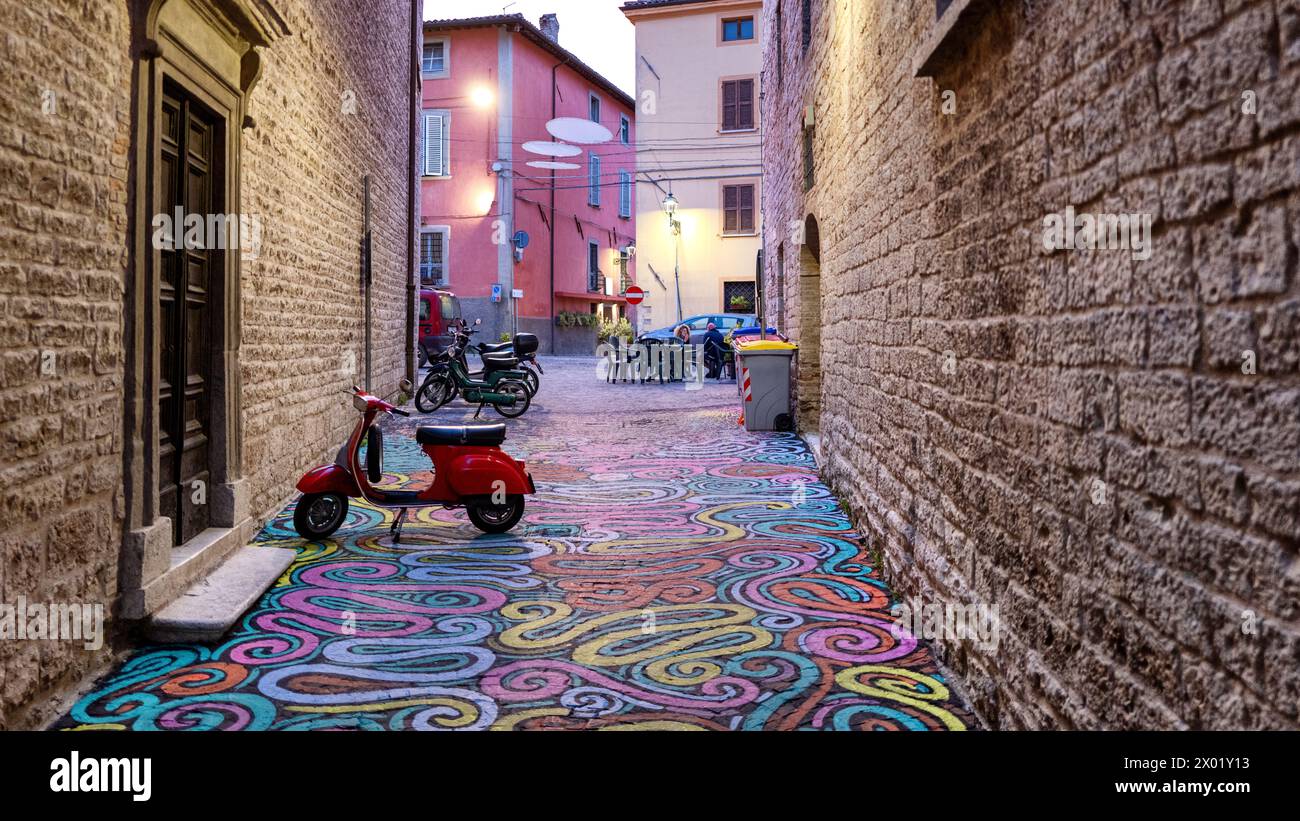 Cagli, Italy - 13 Sept 2023: A red scooter stands parked in a ...