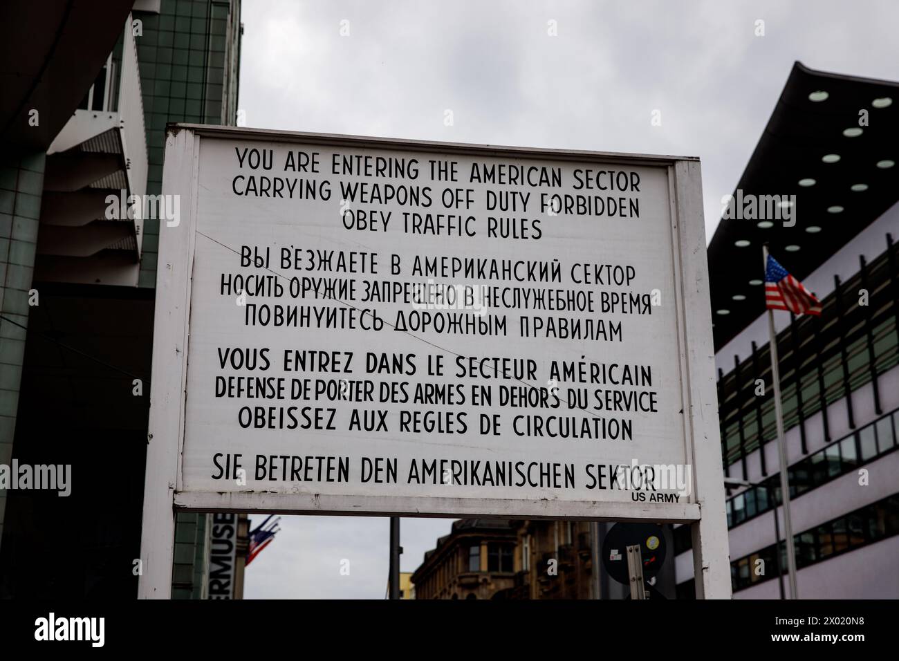 Historical text sign at the Checkpoint Charlie as a border of east and ...