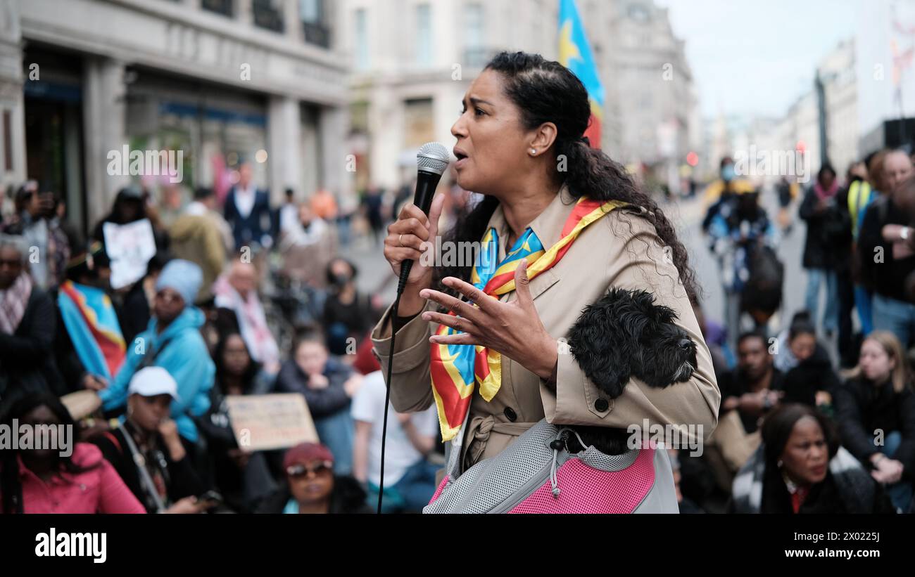 On London's Regent Street, an activist speaks to protesters demanding ...