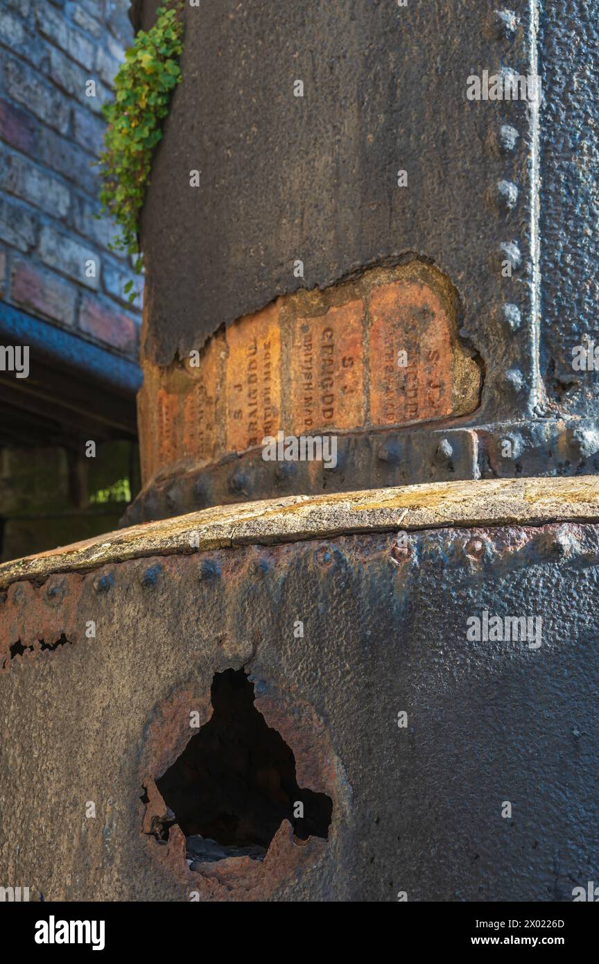 The weathered and corroded base of a chimney stack at the furnaces in ...