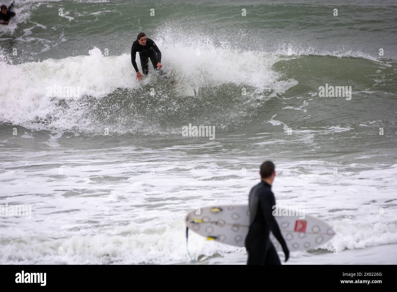 Bournemouth Dorset, UK. 9th Apr, 2024. UK WEATHER Surfers ride the ...