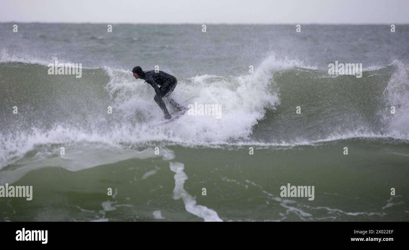Bournemouth Dorset, UK. 9th Apr, 2024. UK WEATHER Surfers ride the ...