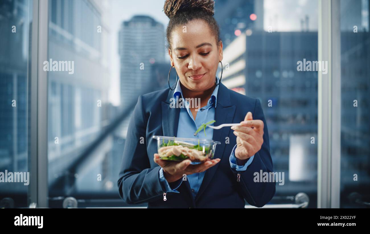 Woman eating salad in elevator hi-res stock photography and images - Alamy