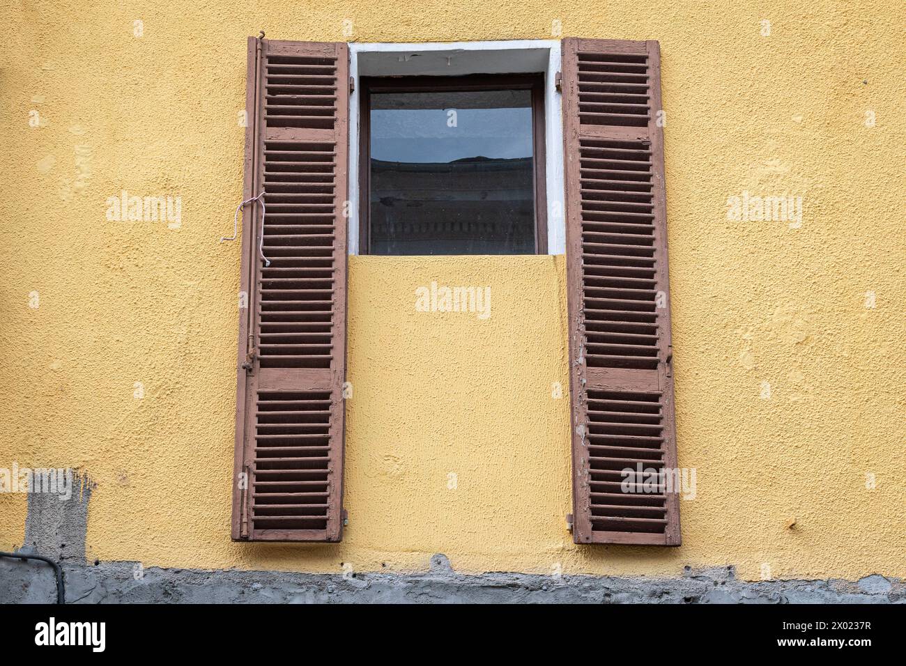Detail of a strange window, partly walled and with, disproportionate ...