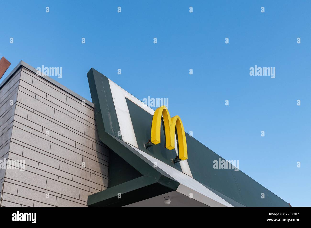 Low-angle view of the logo of the Mc Donald's fast food restaurant ...