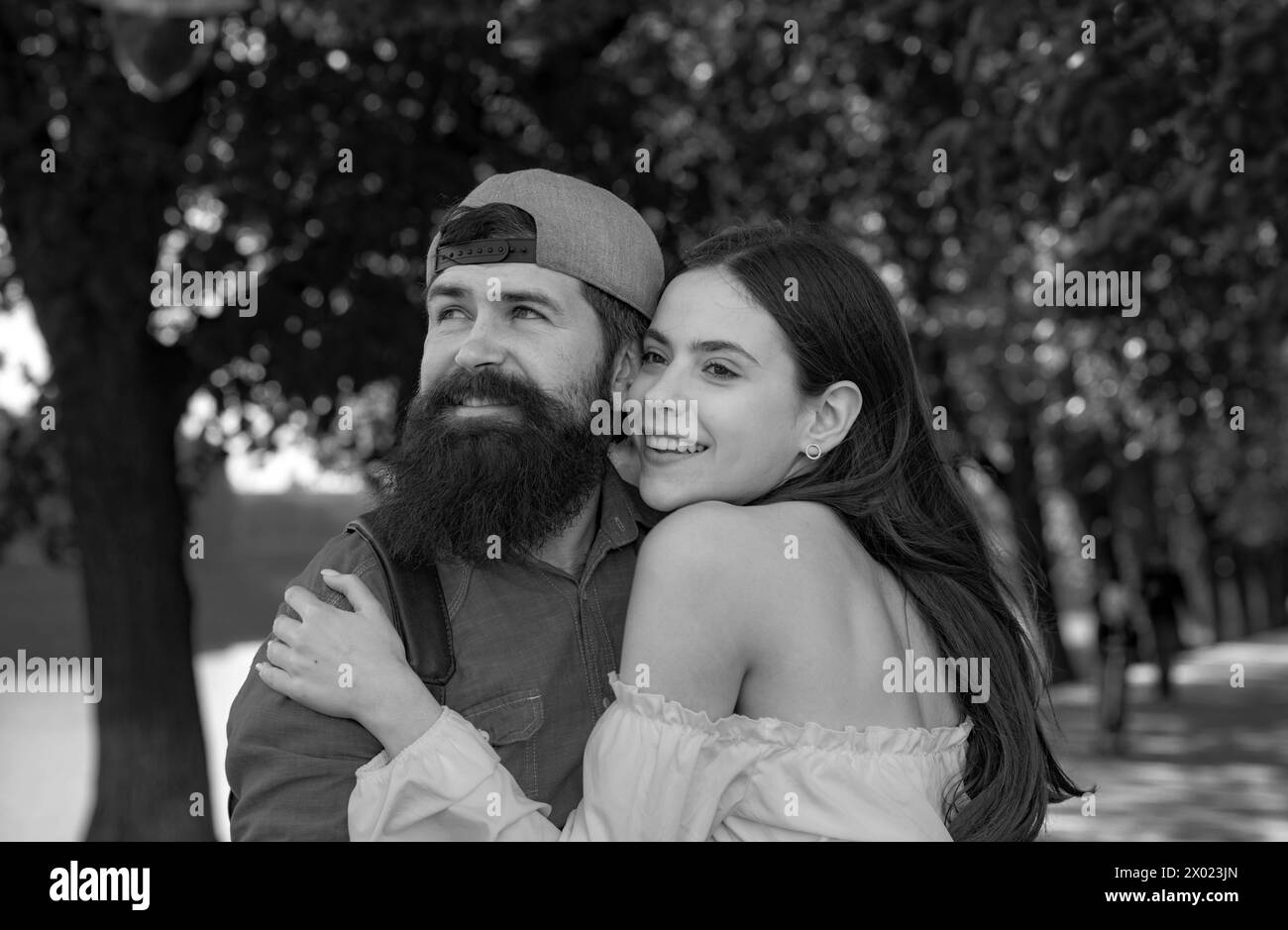 Lovely couple outdoor, looks each other. Summer walk in park. Love and ...