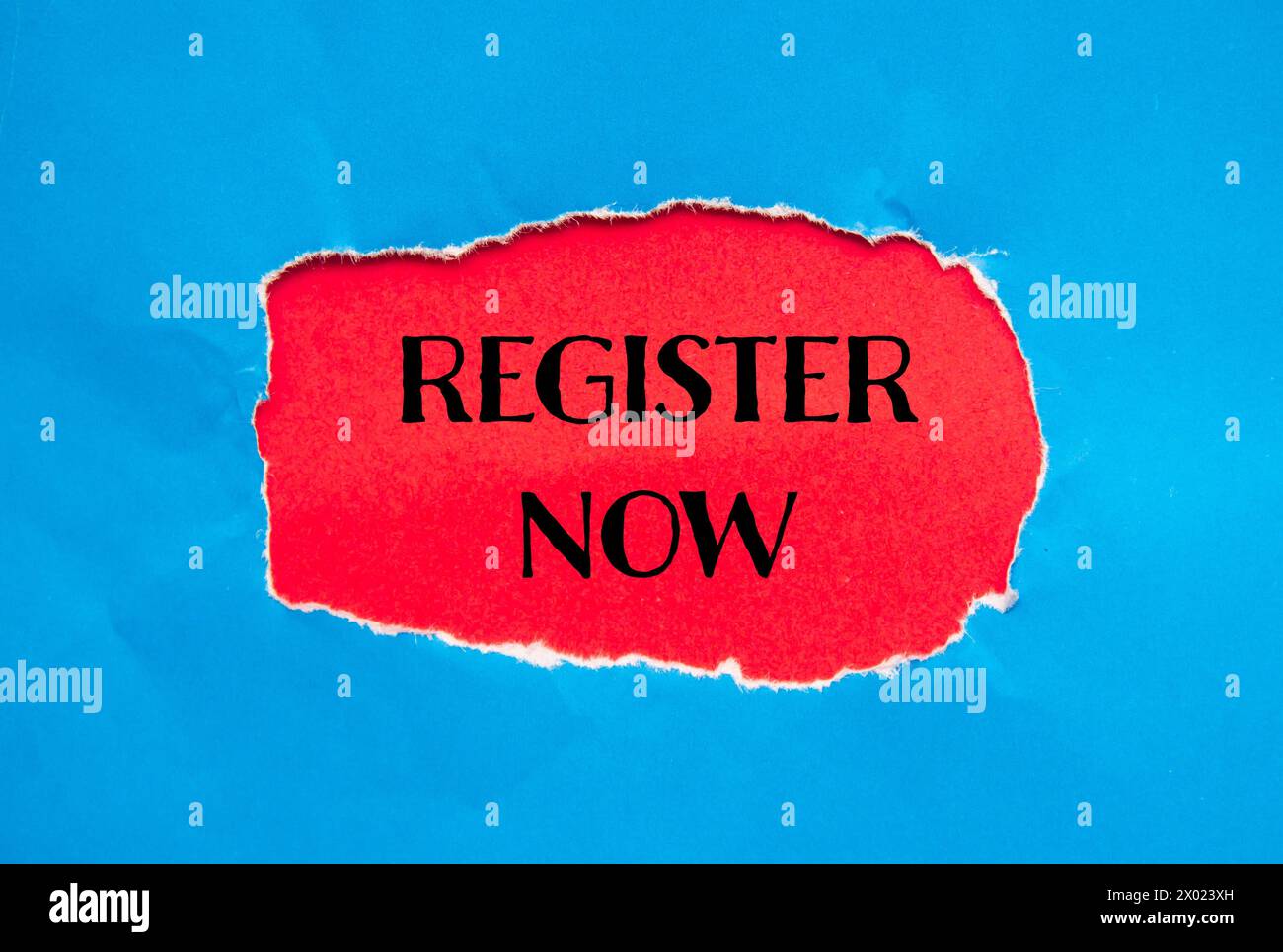 Register now words written on ripped blue paper with red background ...