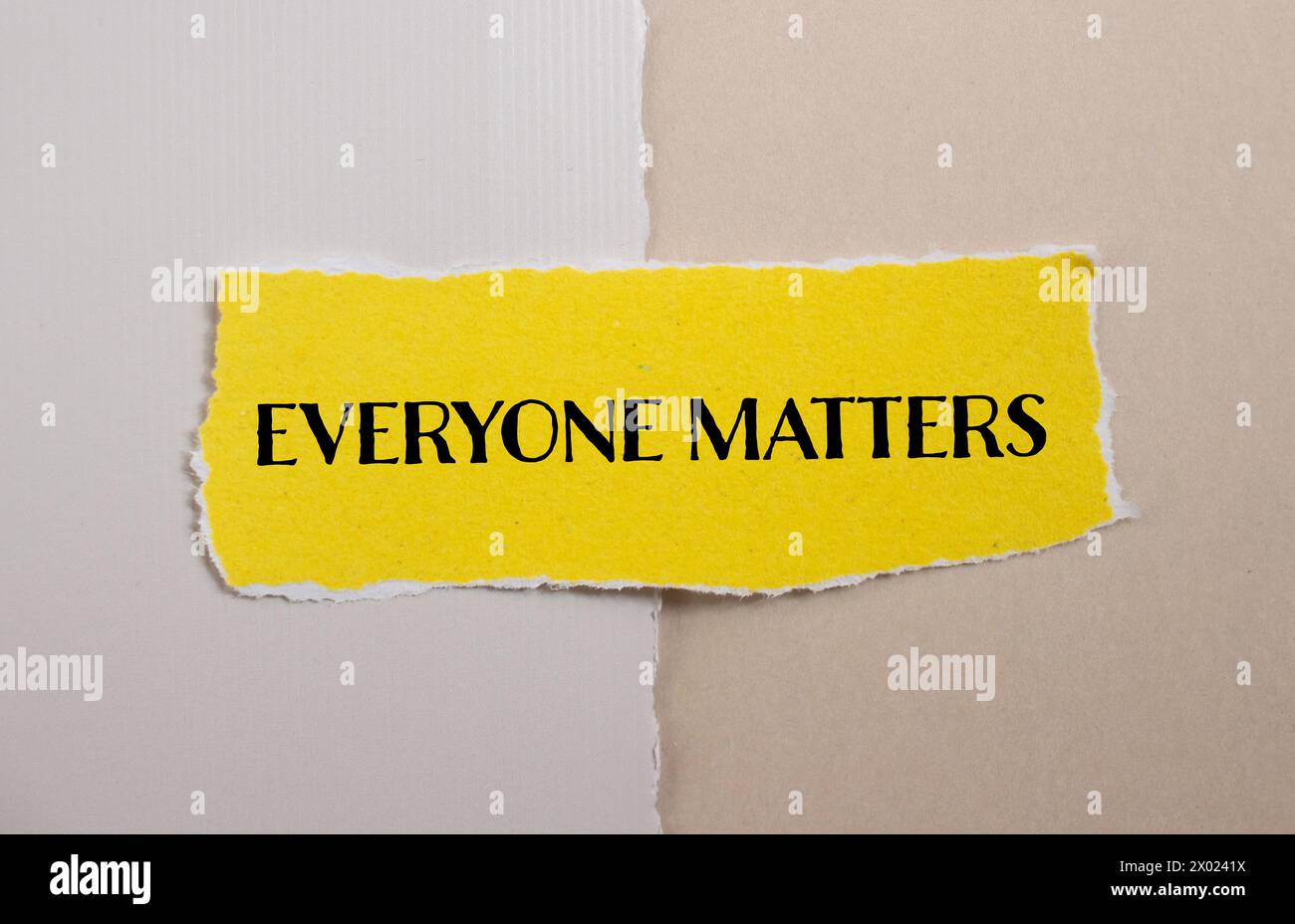 Everyone matters words written on ripped paper with paper background ... Everyone matters words written on ripped paper with paper background ...