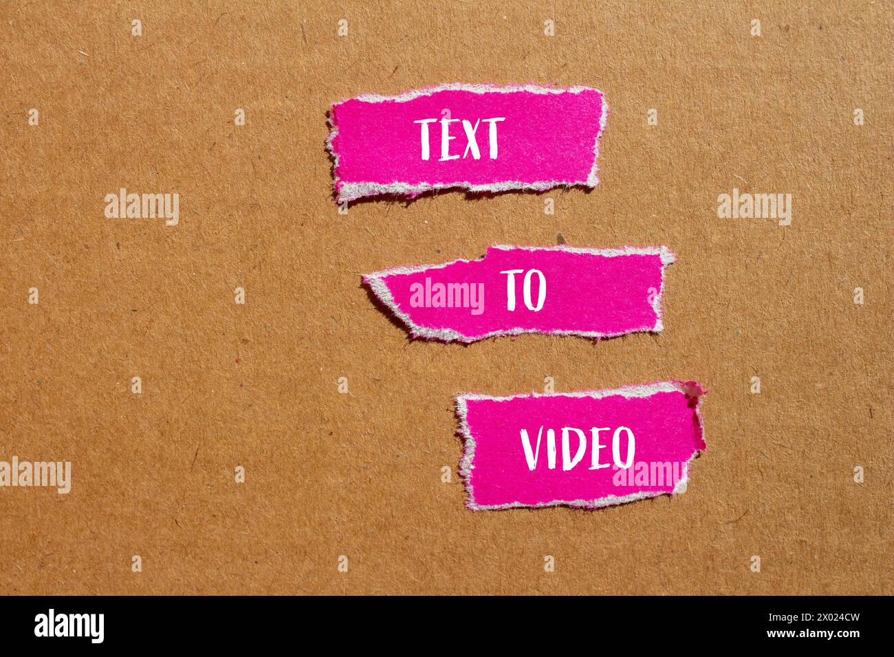 Text to video words written on ripped paper with cardboard background ...
