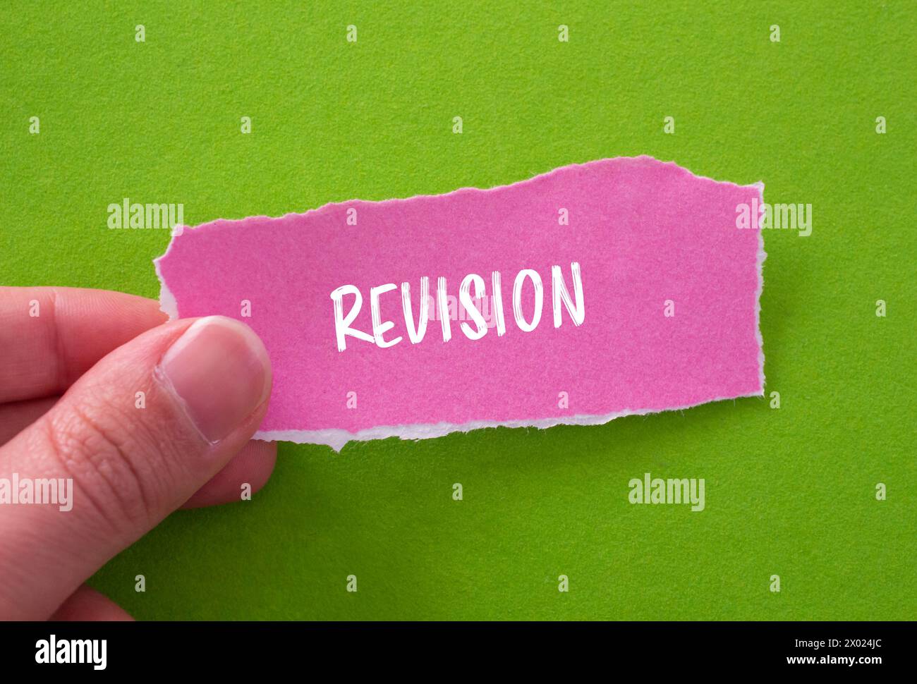 Revision word written on ripped paper with green background. Conceptual ... Revision word written on ripped paper with green background. Conceptual ...