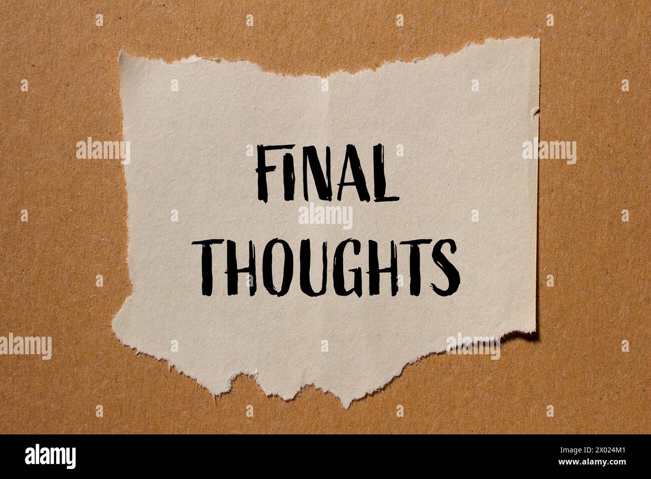 Final thoughts words written on ripped paper with brown background ...