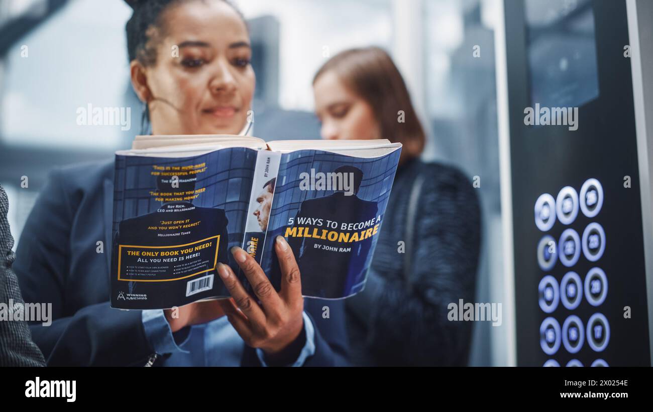 Black female riding elevator reading hi-res stock photography and ...