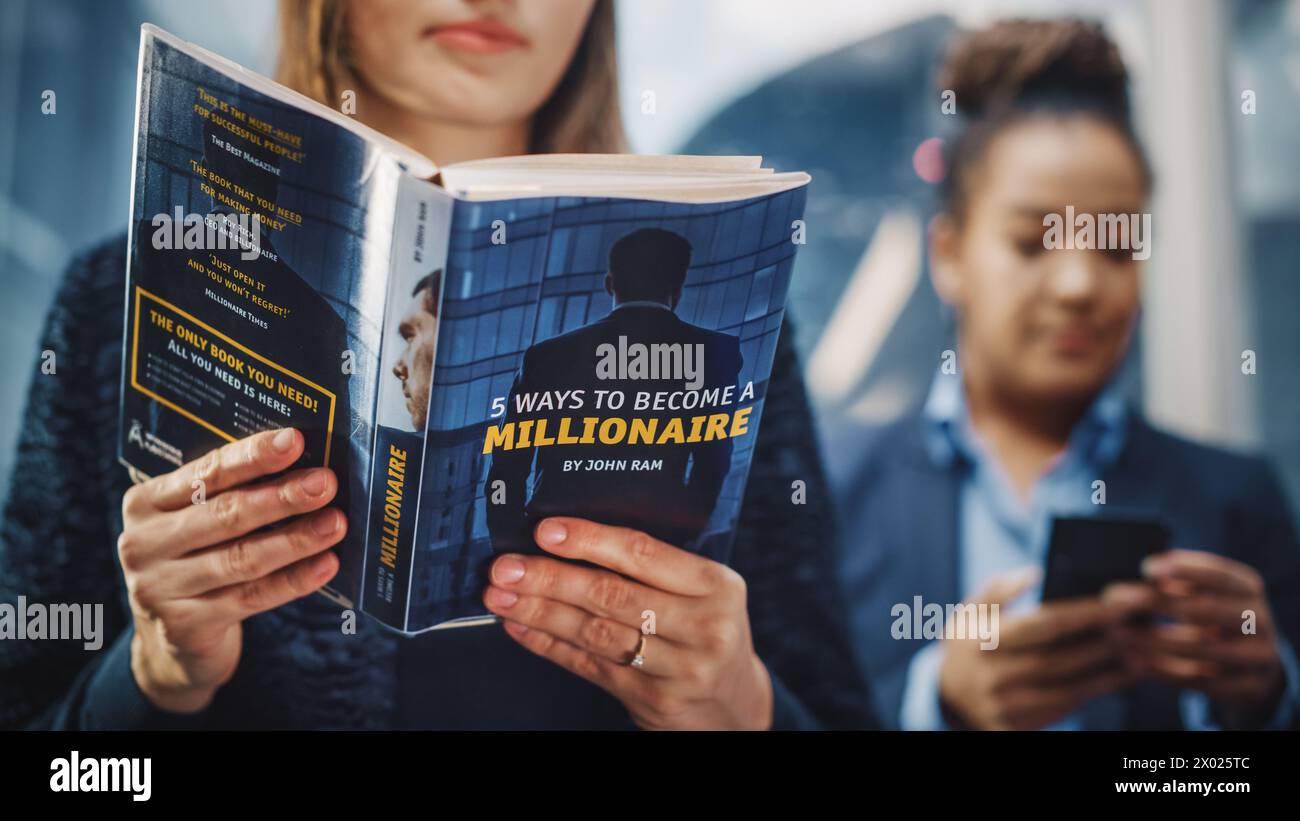 Female riding elevator reading book hi-res stock photography and images ...